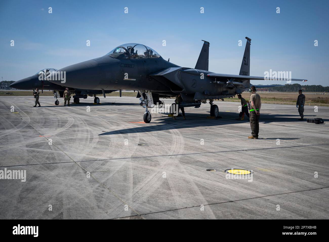 F-15E Strike Eagles assigned to the 4th Fighter Wing sit on the taxiway ...