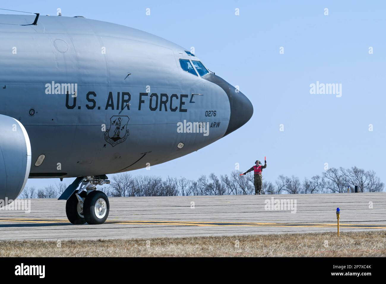 An Airman with the 155th Air Refueling Wing signals to park for a KC ...