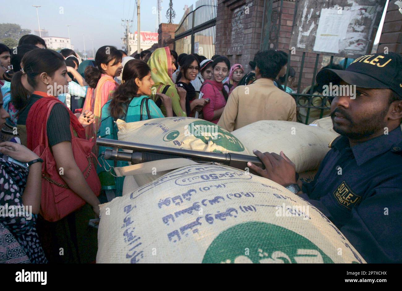 A Pakistani private security guard stands guard inside a bunker as ...