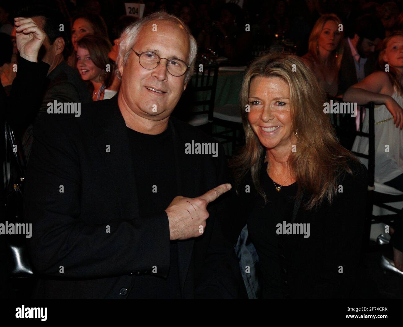 Chevy Chase, left, points to his wife, Jayni Chase, during the 20th ...
