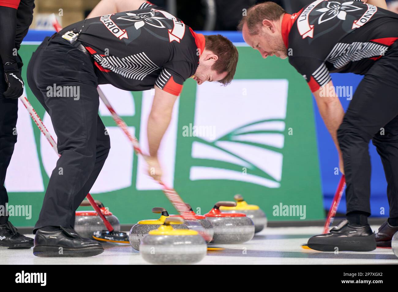 Ontario lead Joey Hart and second Brent Laing work hard on a shot ...