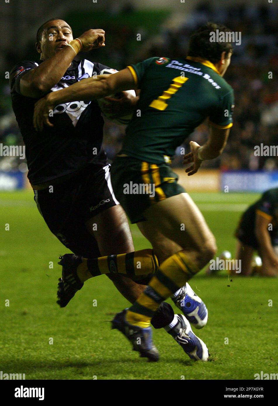 New Zealand's Frank Pritchard, left, breaks the tackle of Australia's ...