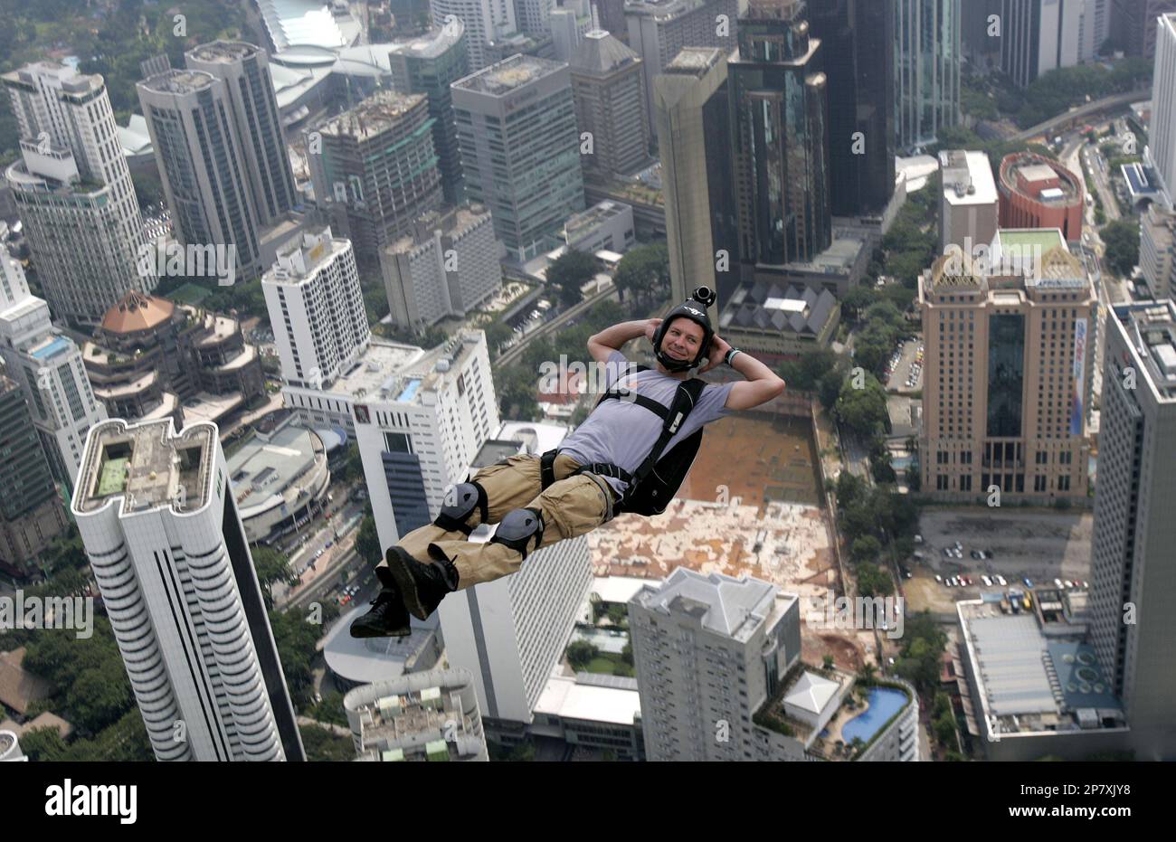 An unidentified BASE jumper leaps from the height of 300 meters of ...