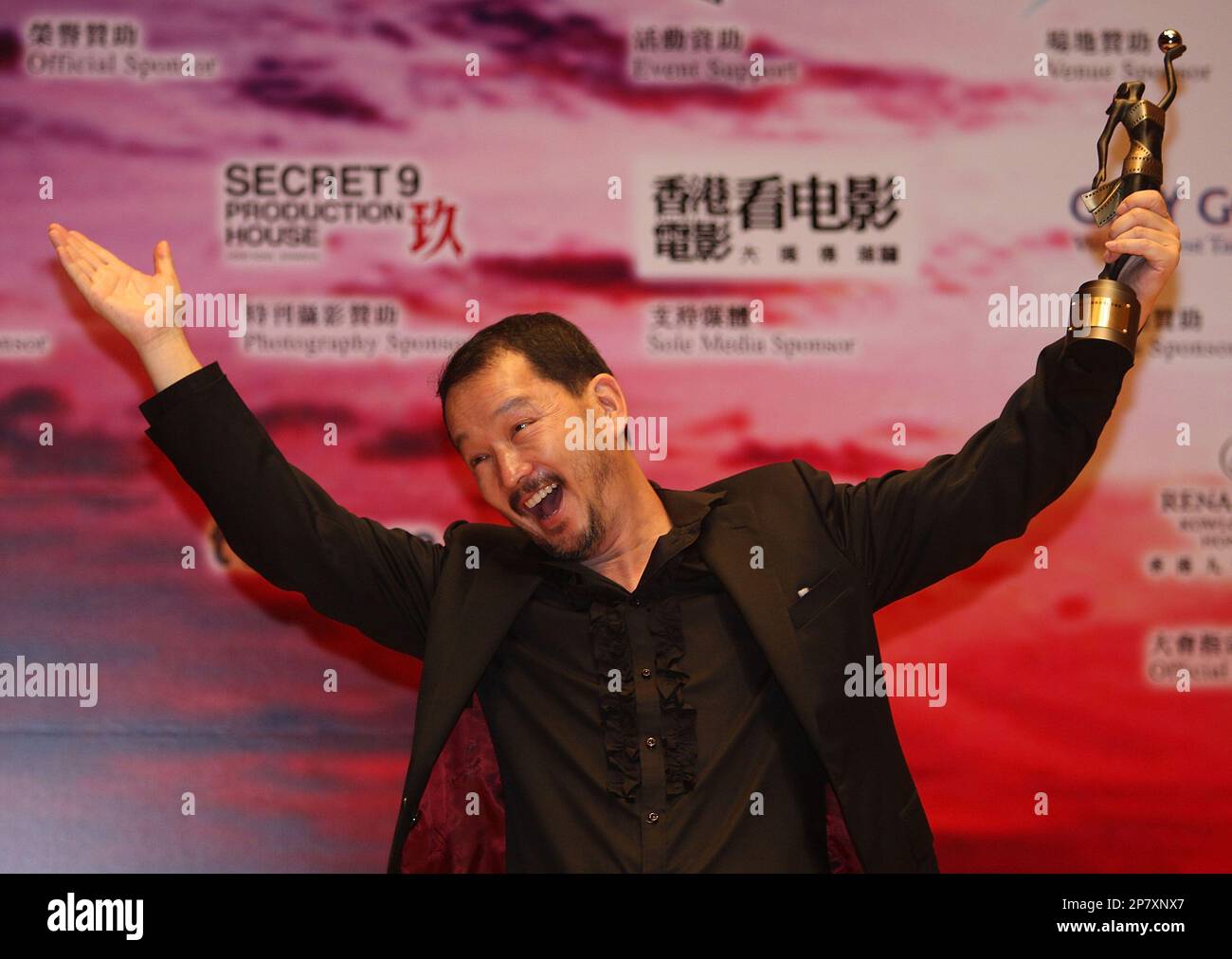 Hong Kong actor Liu Kai Chi poses for photos after he won the Best ...
