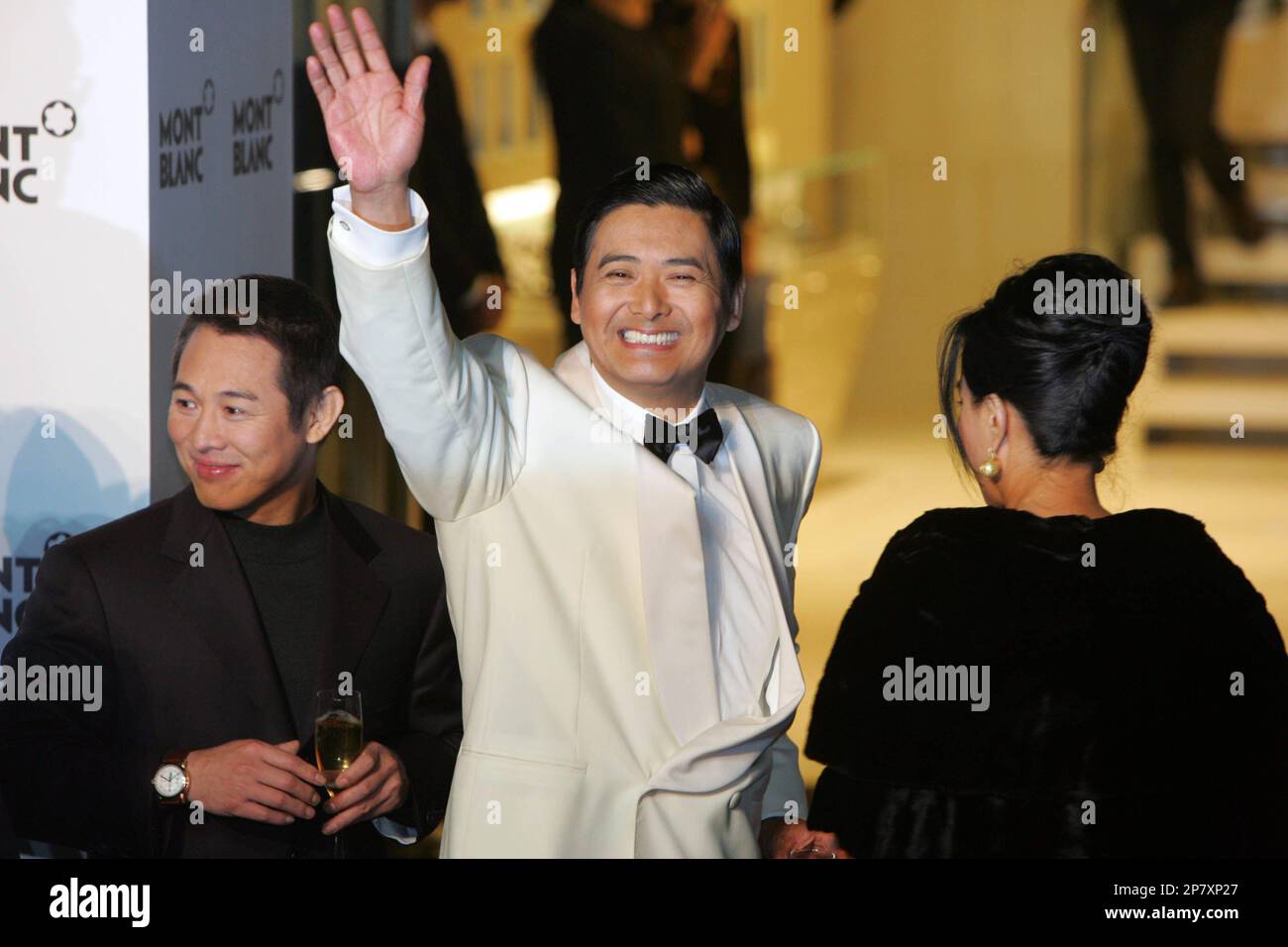 Hong Kong actor Yun-Fat Chow (C) and his wife Jasmine Chow (R) and ...