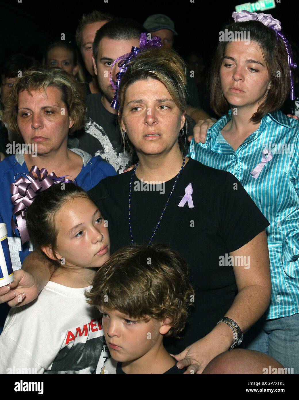 Diena Thompson, center, and her daughter, Abby Thompson, lower left ...