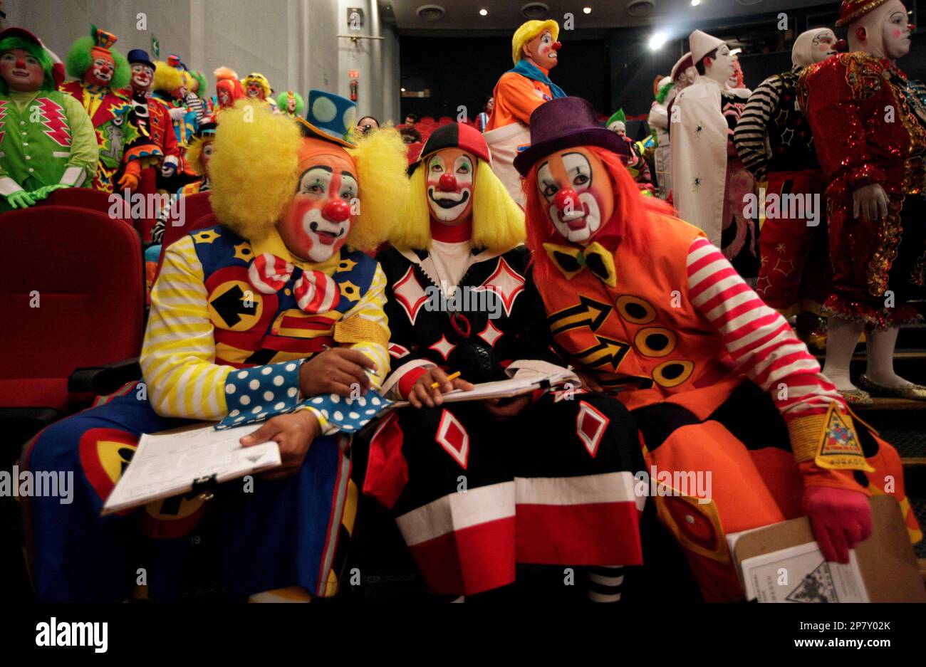 Three judges take a look at a contestant, unseen, in a makeup ...