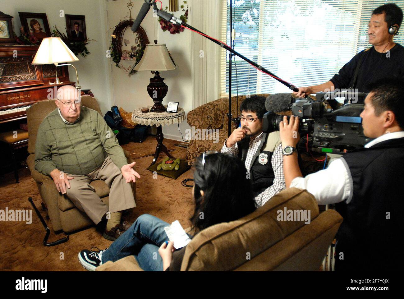 World War II veteran Laverne Coulthard talks with a film crew from ...