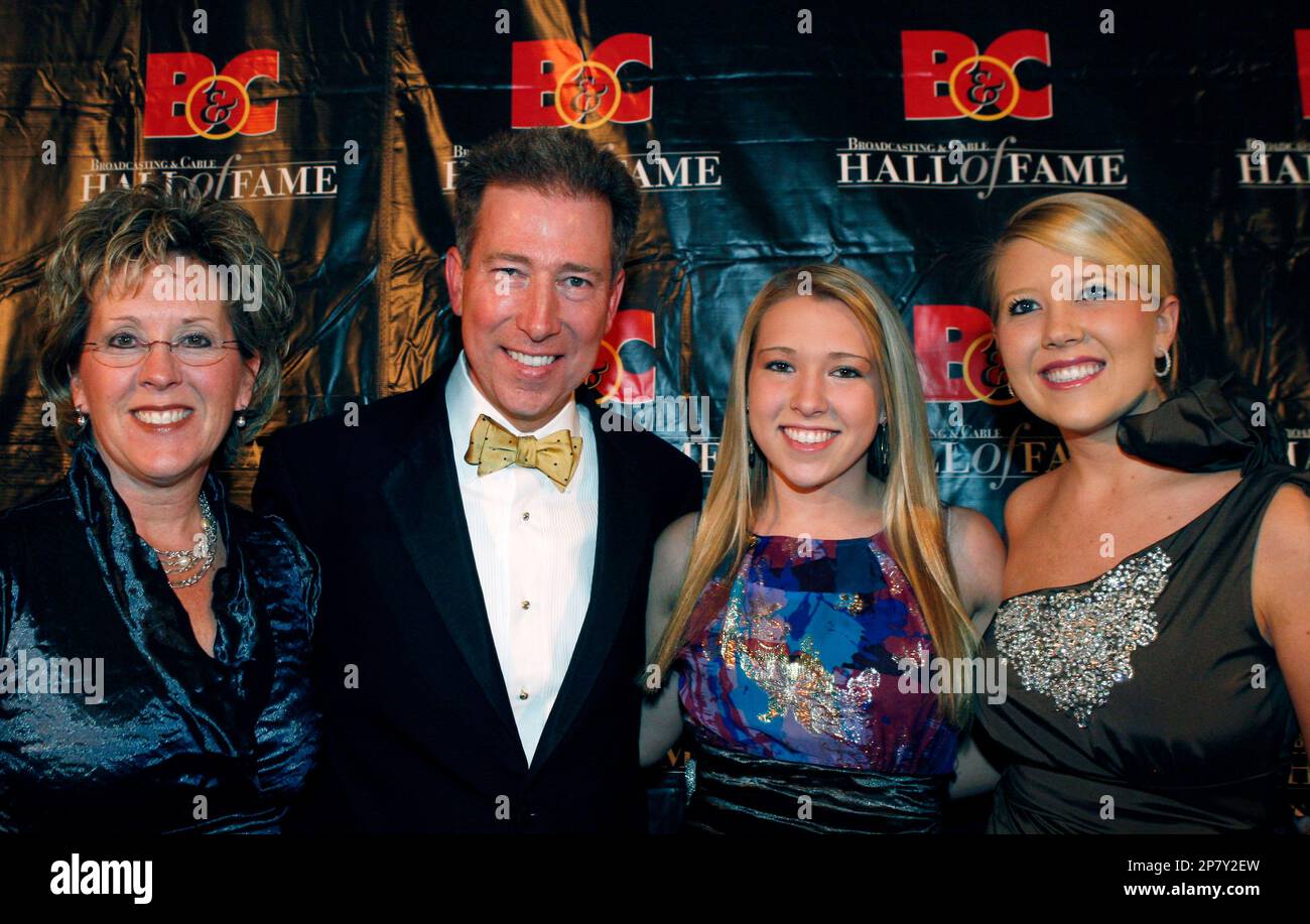 Pat Esser, president of Cox Communications, second from left, poses ...