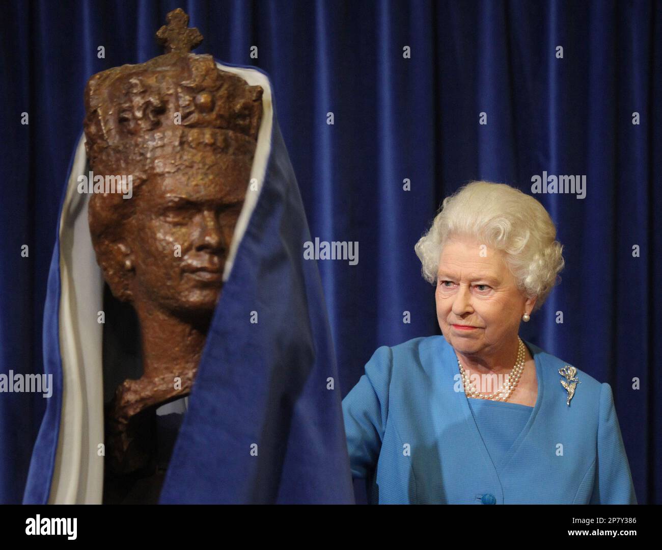 Britain's Queen Elizabeth II unveils a portrait bust of herself by ...