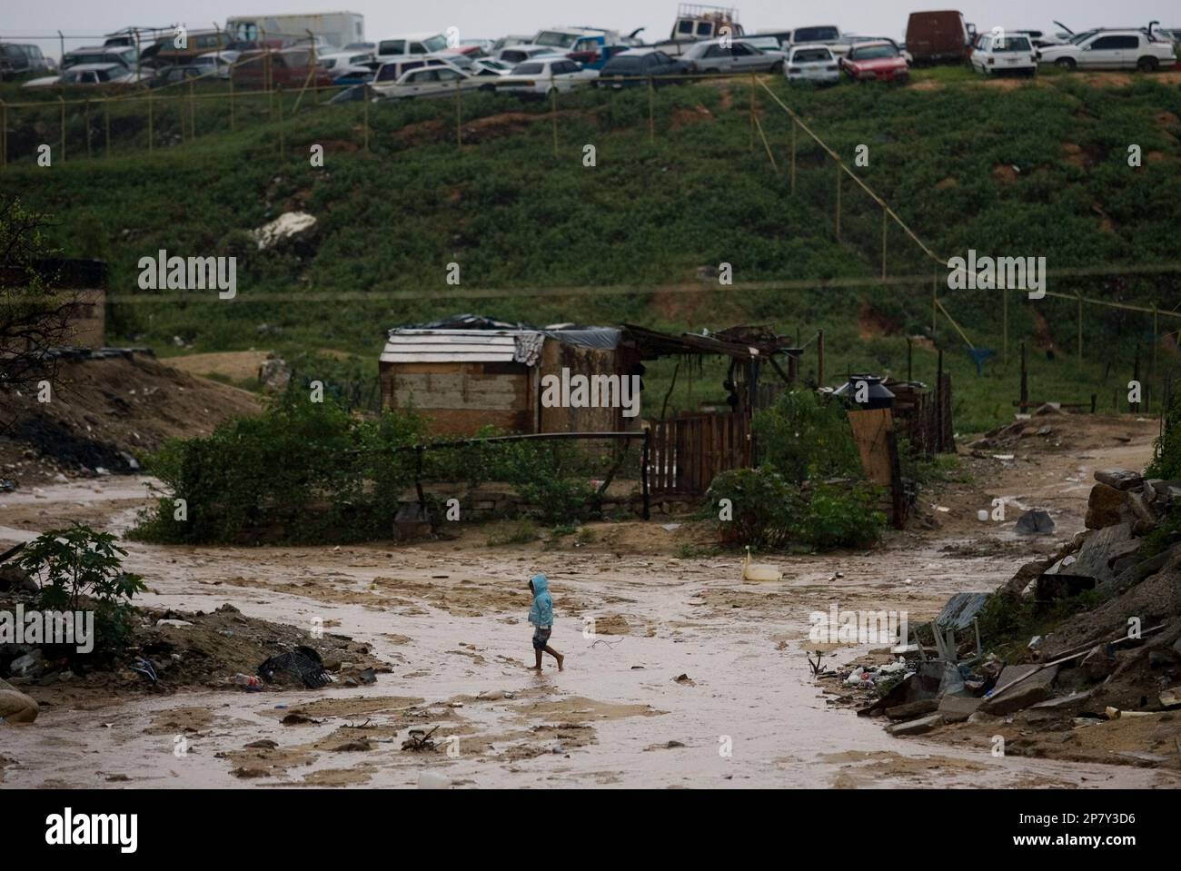 A child walks in a neighborhood as Tropical Storm Rick approaches Cabo ...
