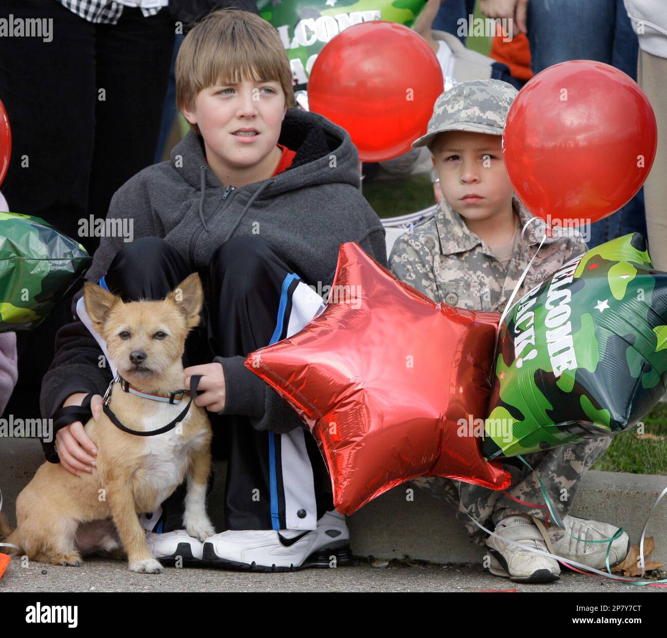 Nolan Gay, 12, left, his brother Jordan Matney, 5, and their dog Buddy ...