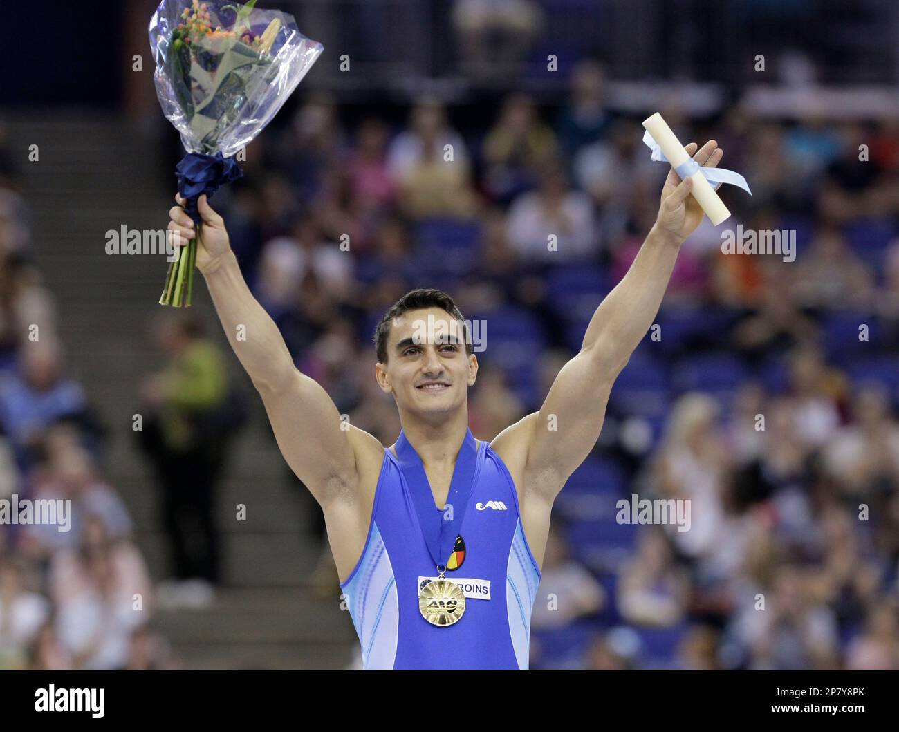 Marian Dragulescu of Romania stands on the podium with his gold medal ...