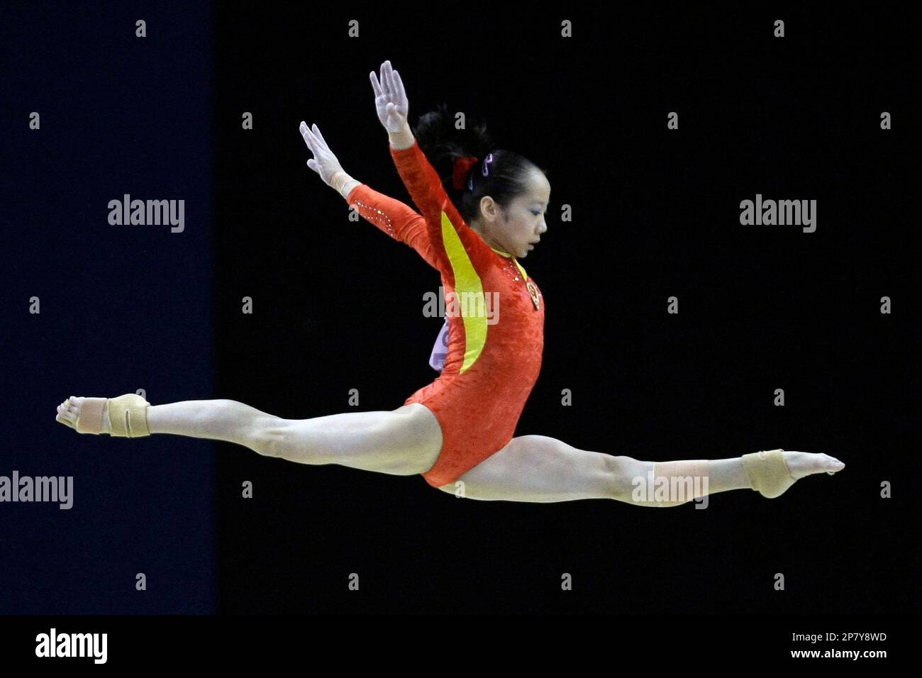 Deng Linlin of China in action in the women's balance beam final during ...