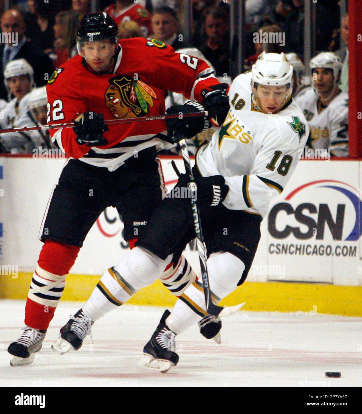 Dallas Stars' James Neal (18) is checked by Chicago Blackhawks' Troy ...