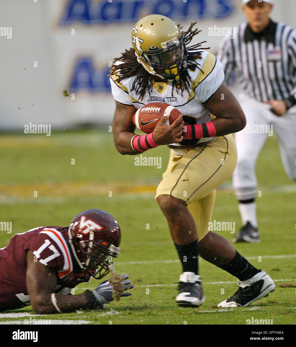 Georgia tech's Anthony Allen, right, gets past Virgina Tech defender ...