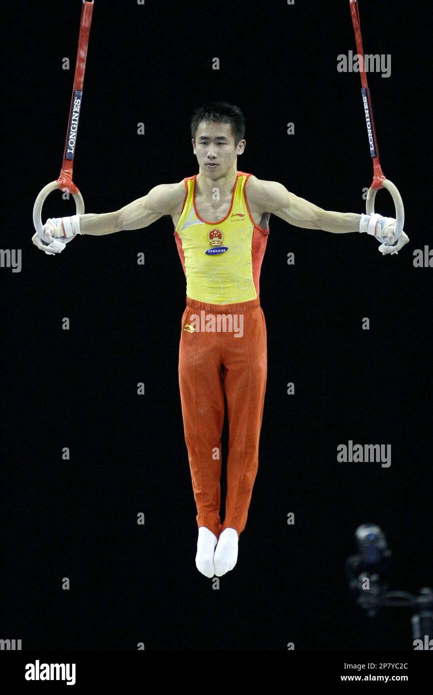 Yan Mingyong of China in winning action in the men's rings final during ...