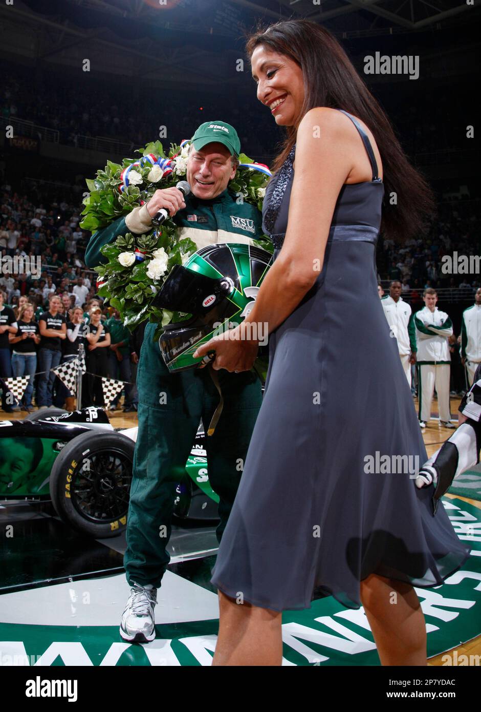 Michigan State basketball coach Tom Izzo, left, is greeted by his wife ...