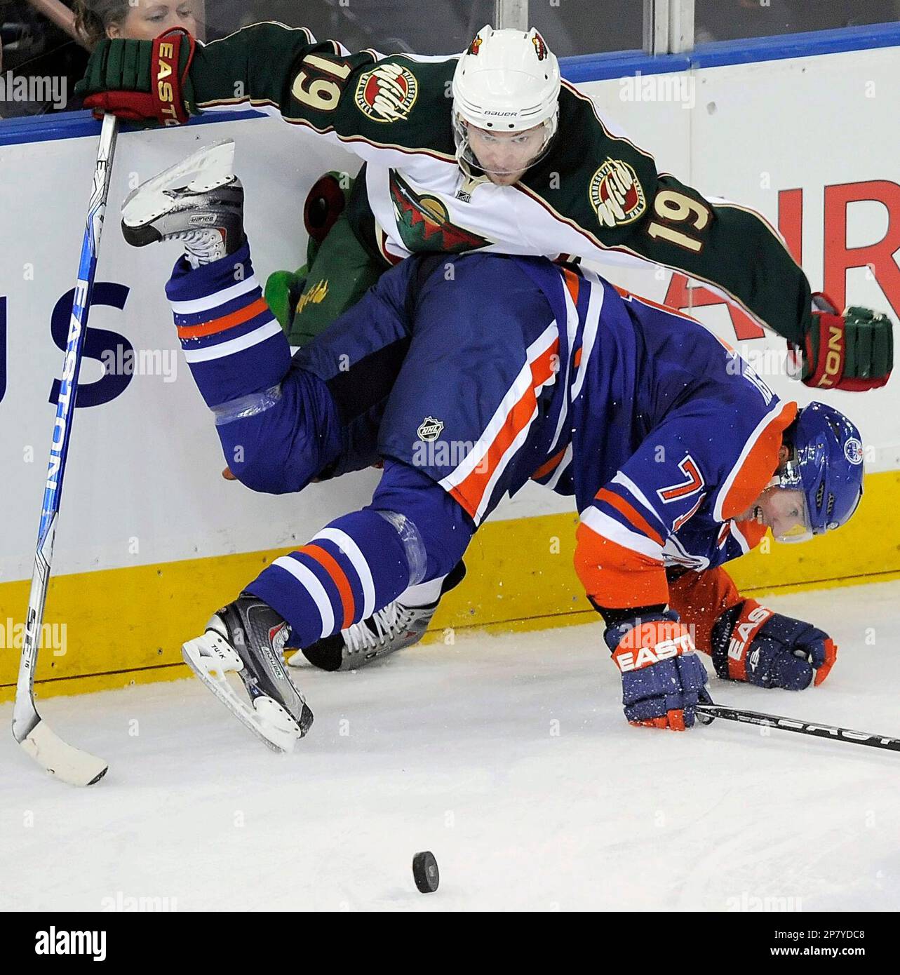Minnesota Wild center Andy Hilbert (19) collides with Edmonton Oilers ...