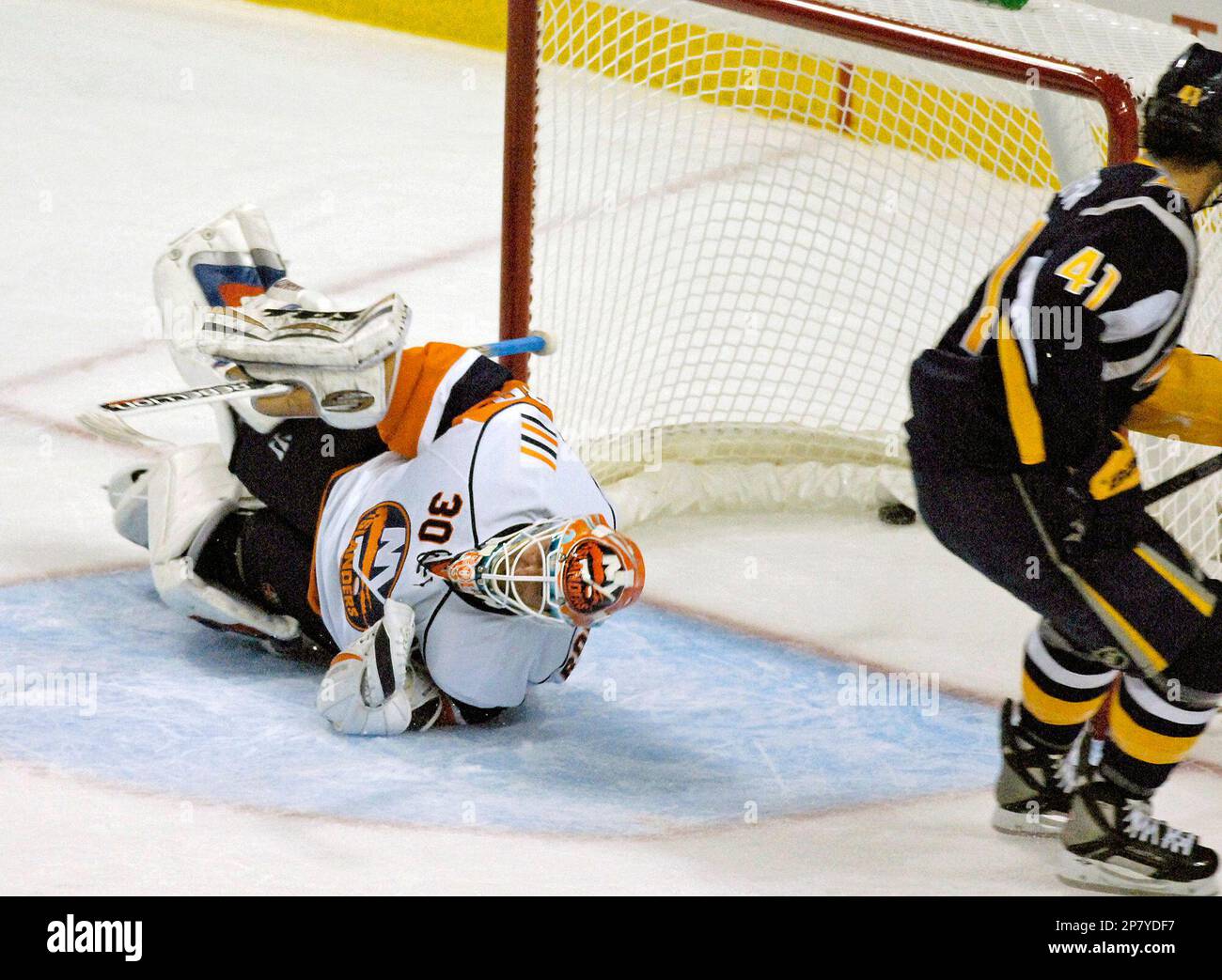 New York Islanders goalie Dwayne Roloson, left, allows a penalty-shot ...