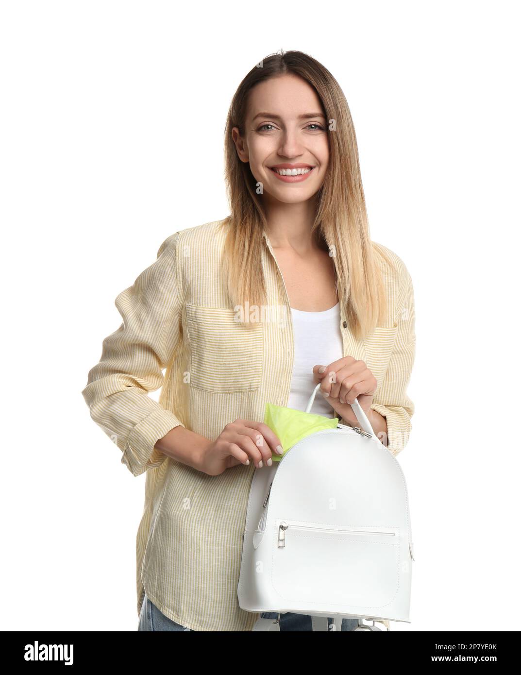 Happy young woman putting disposable menstrual pad into backpack on ...