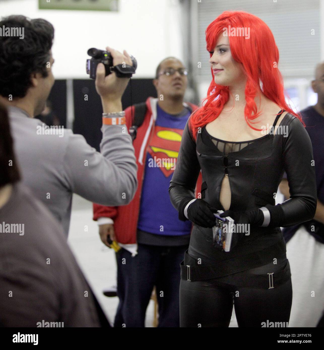 A woman dressed as as comic book character is photographed at the Big ...