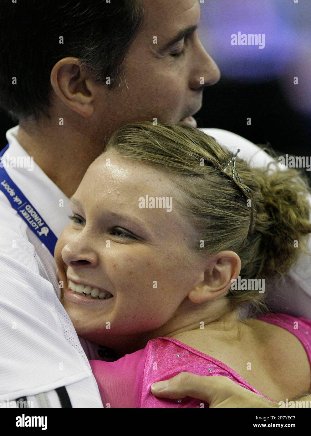 Bridget Sloan of the US gets a hug from her coach Marvin Sharp after ...