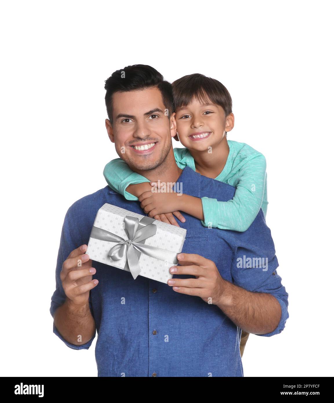 Man receiving gift for Father's Day from his son on white background ...