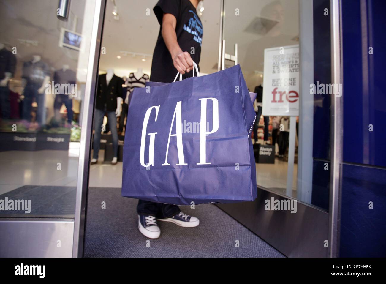In this Aug. 19, 2009 photo, a shopper leaves a Gap store in Palo Alto ...