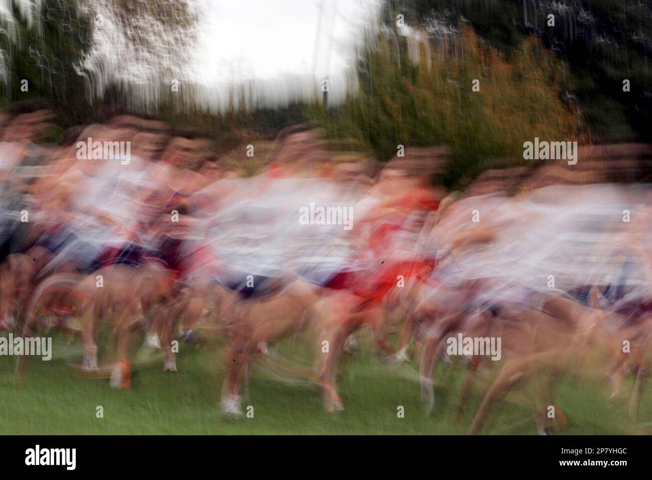 Boys cross country runners become a multi colored blurr due to a slow ...