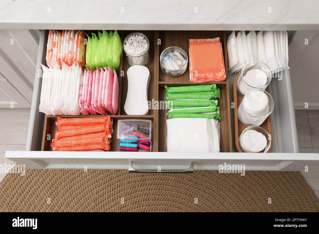 Storage of different feminine hygiene products in drawer indoors, top ...