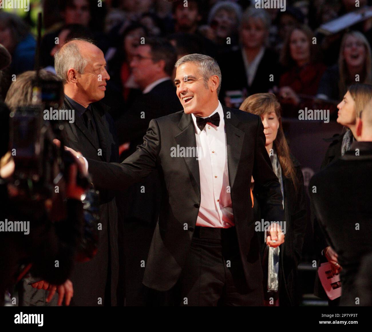 US actor George Clooney jokes with members of the press as he arrives ...