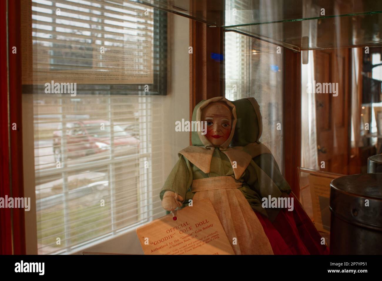 A vintage doll holding papers that read Official Goodie Cole Doll ...