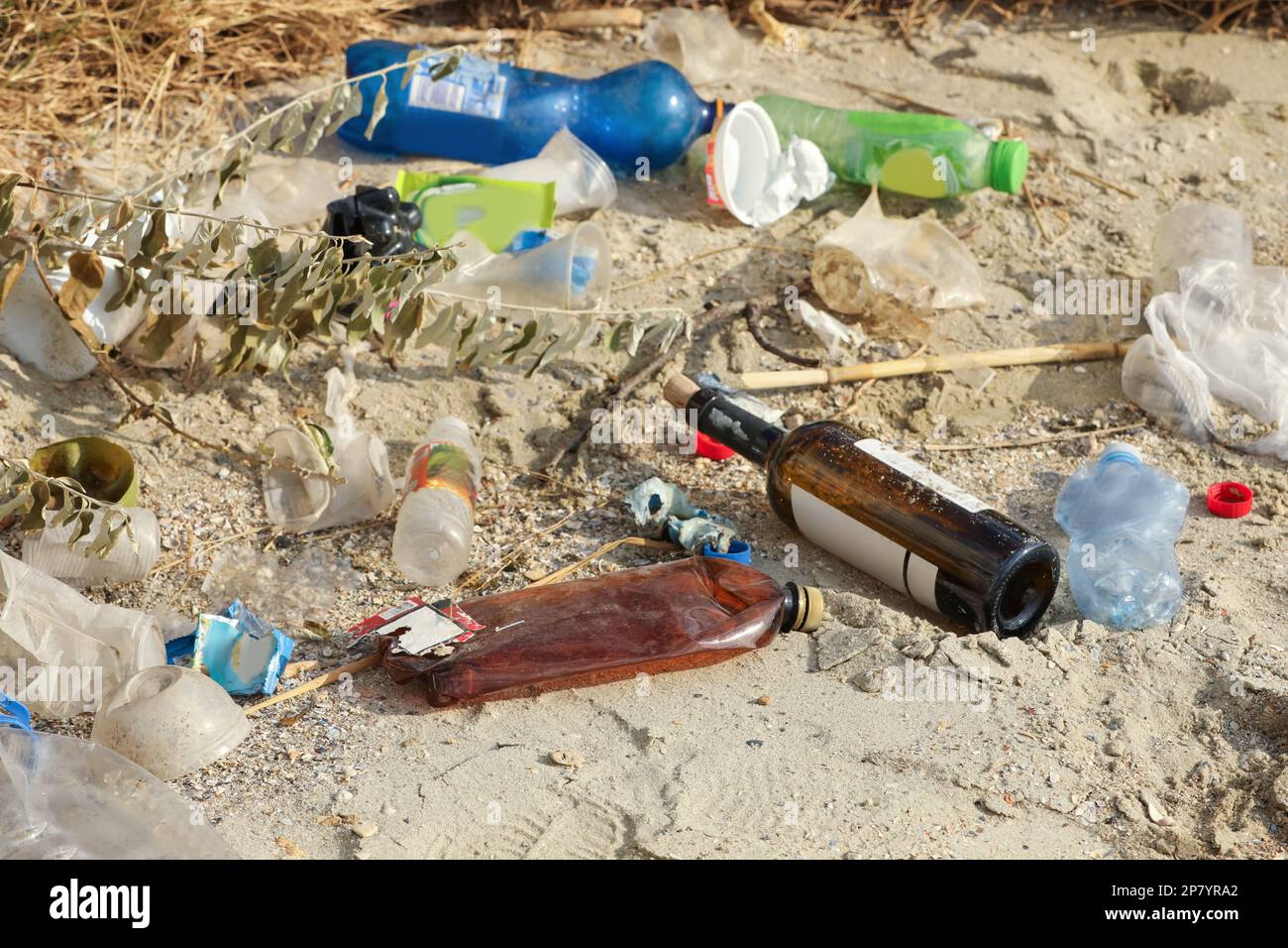 Garbage scattered on beach. Environment pollution problem Stock Photo ...