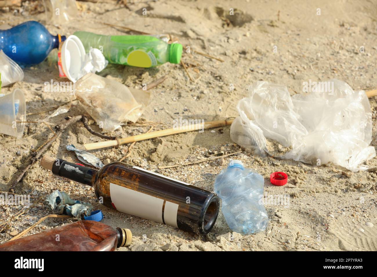 Garbage scattered on beach. Environment pollution problem Stock Photo ...