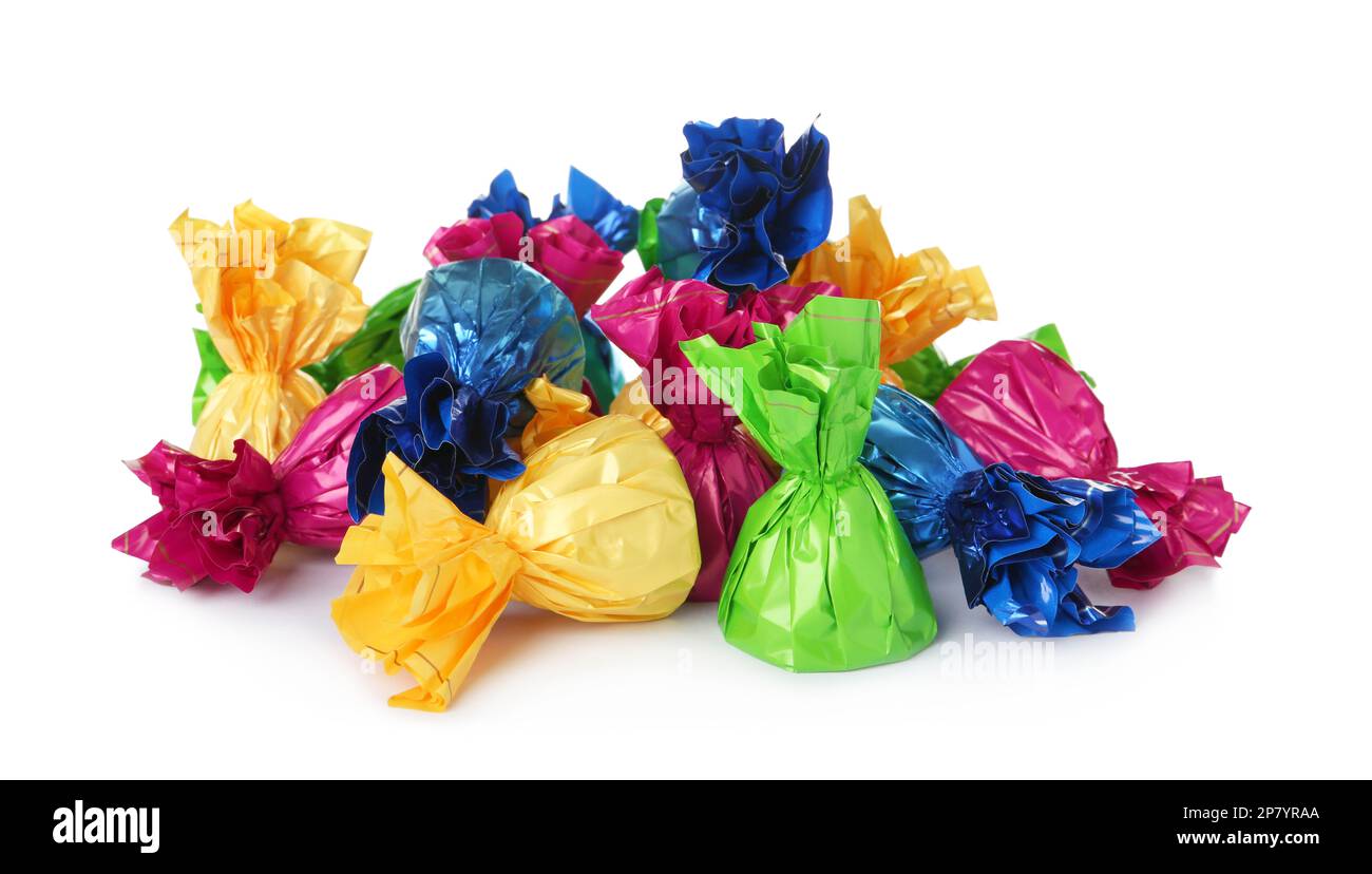 Delicious candies in colorful wrappers on white background Stock Photo ...