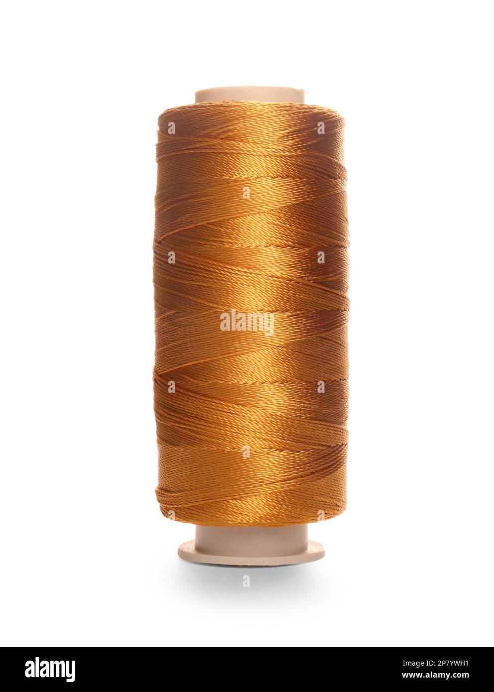 Spool of dark orange sewing thread isolated on white Stock Photo - Alamy
