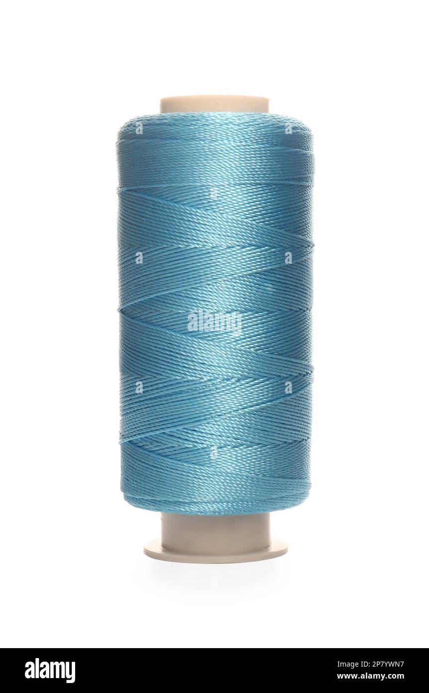 Spool of light blue sewing thread isolated on white Stock Photo - Alamy