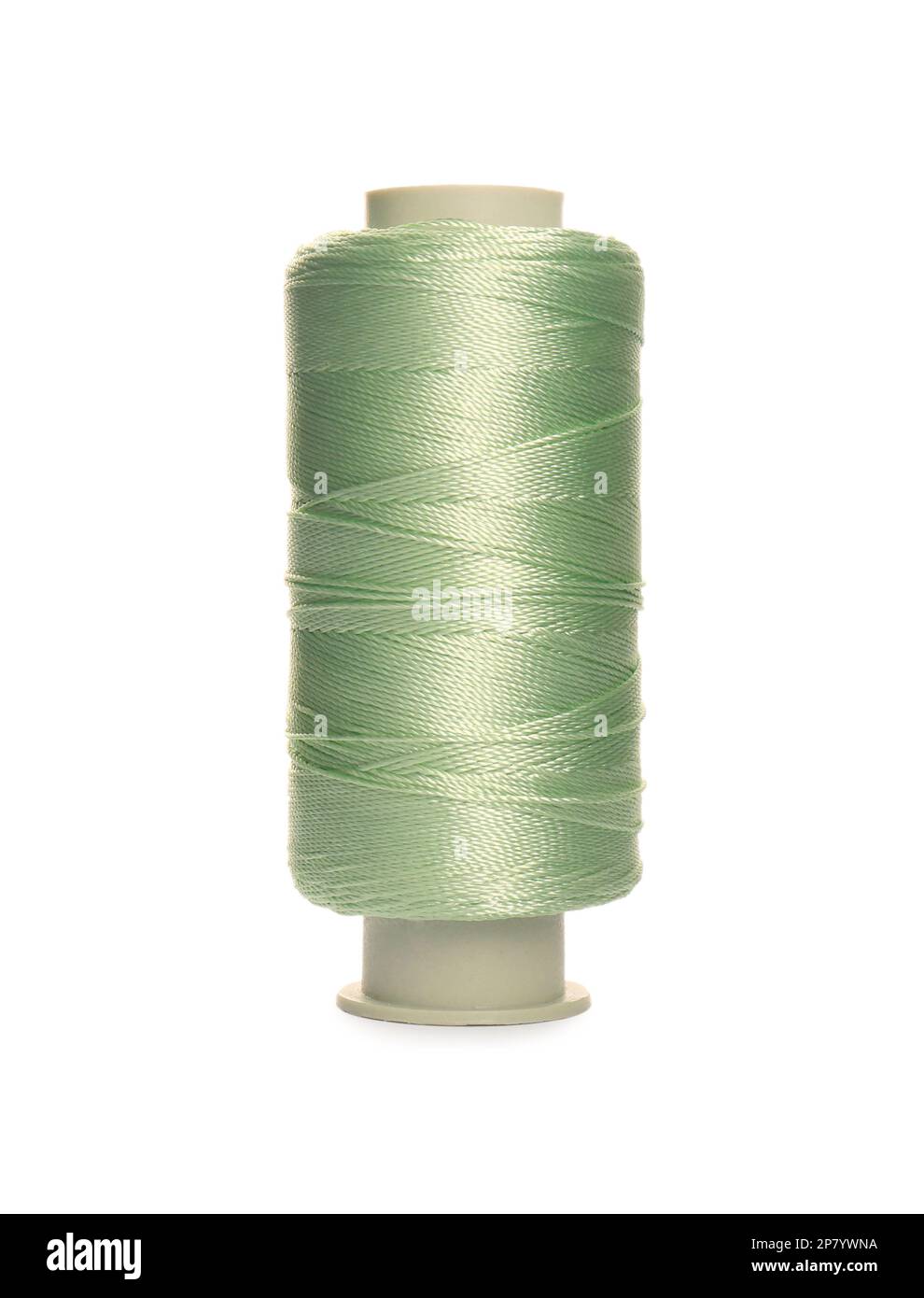 Spool of light green sewing thread isolated on white Stock Photo - Alamy