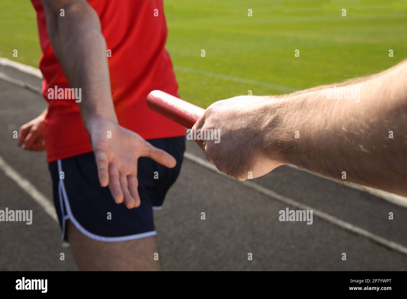Passing the baton business hi-res stock photography and images - Alamy