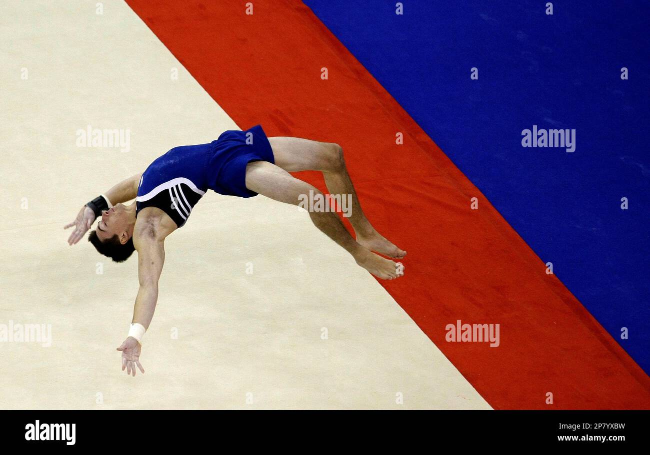Tim McNeill of the U.S. performs on the floor during men's qualifying ...