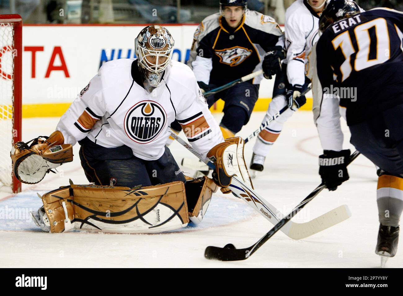 Edmonton Oilers goalie Jeff Drouin-Deslauriers, left, sets up for a ...