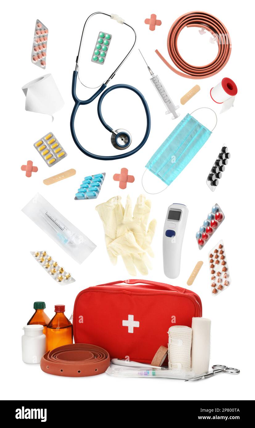 First aid kit. Different medical supplies falling on white background ...