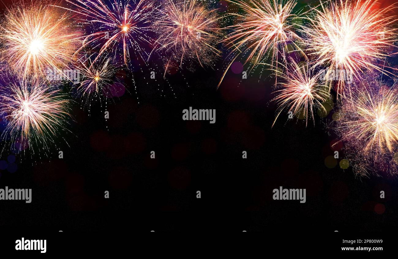 Beautiful bright firework lighting up night sky Stock Photo - Alamy