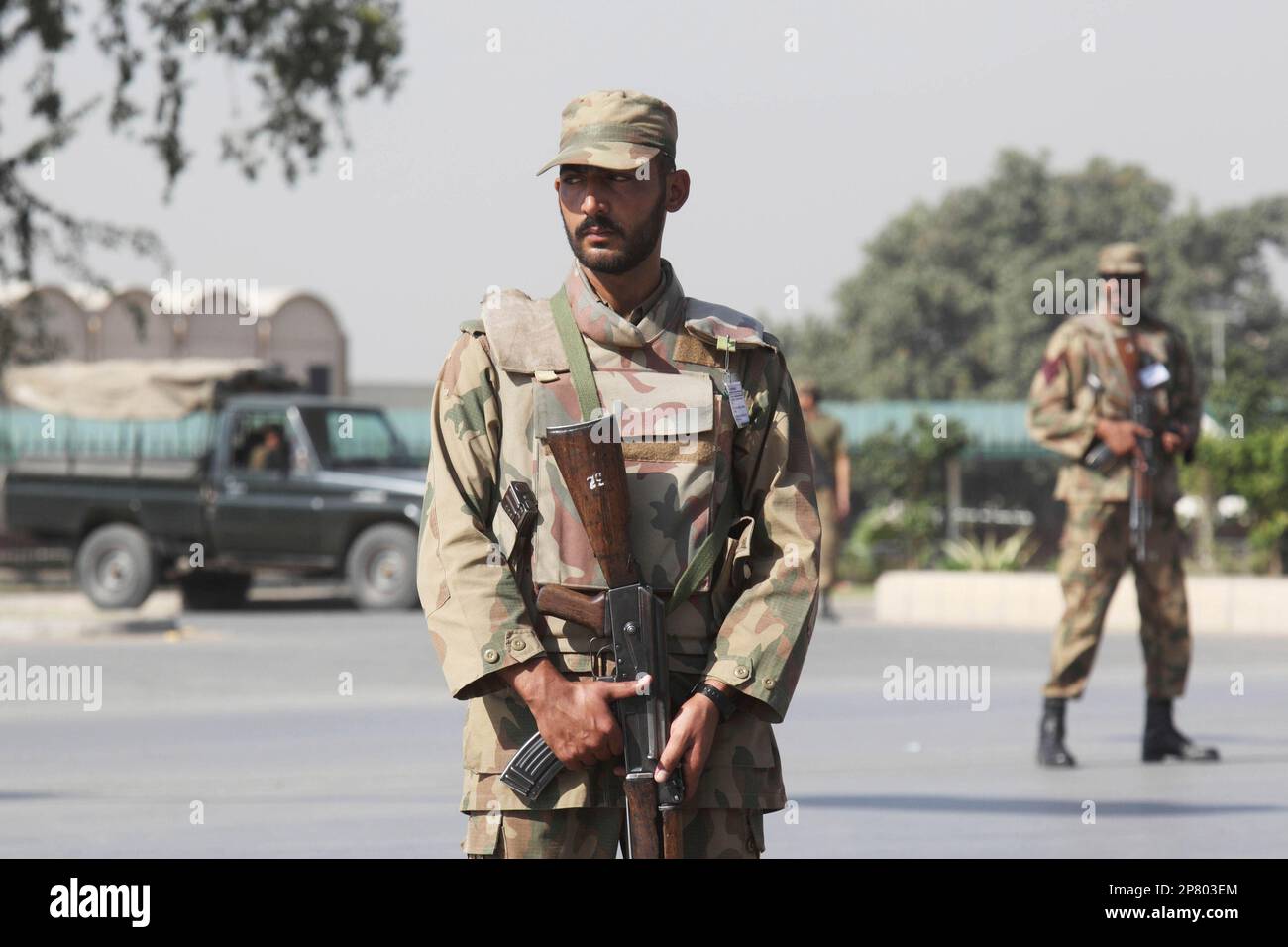 Pakistani soldiers stand in front of the army's headquarters in ...