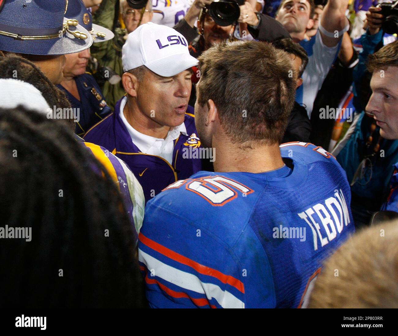 LSU coach Les Miles congratulates Florida quarterback Tim Tebow (15) on ...