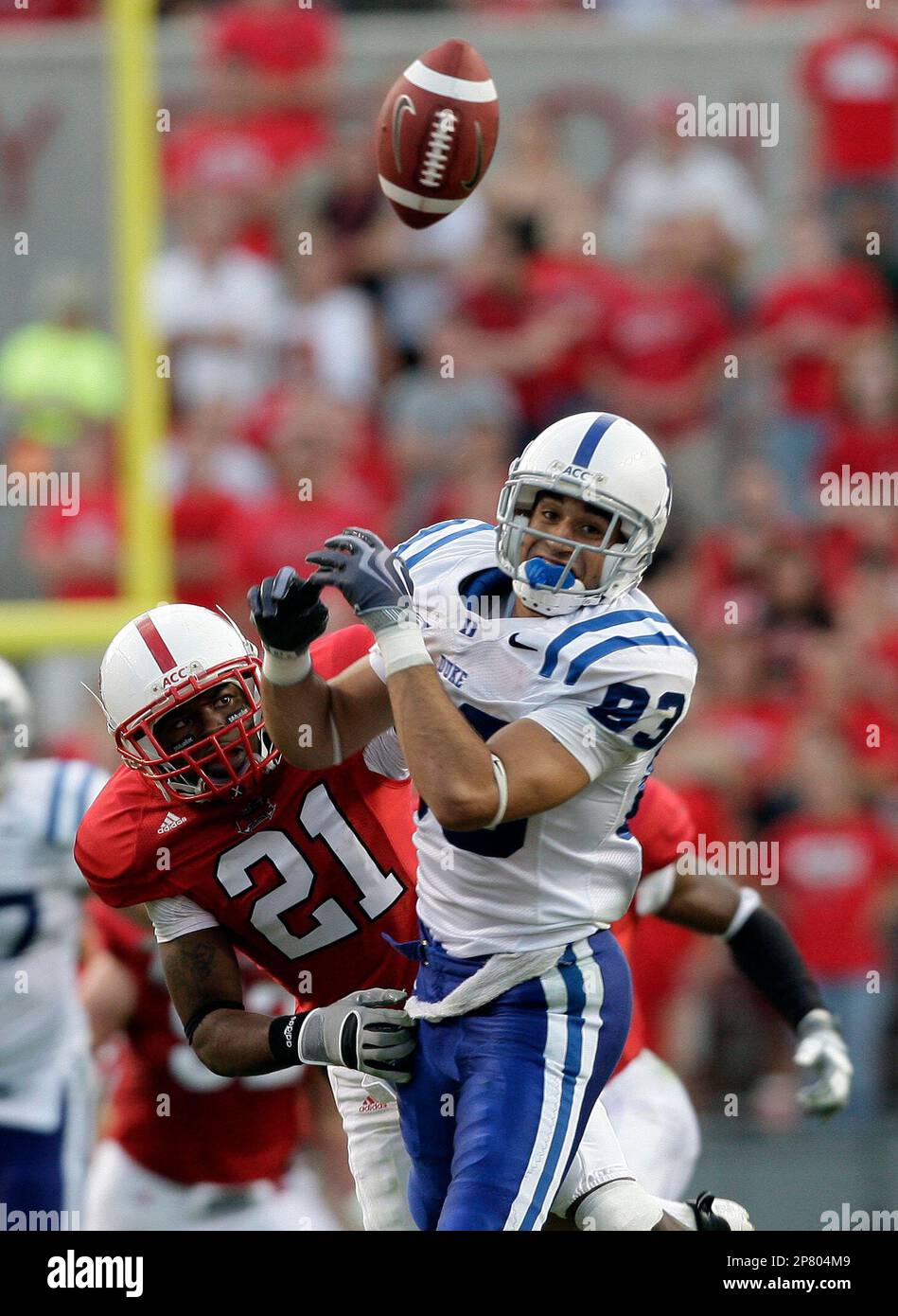 North Carolina State's Marty Stoner (21) and Duke's Austin Kelly (83 ...
