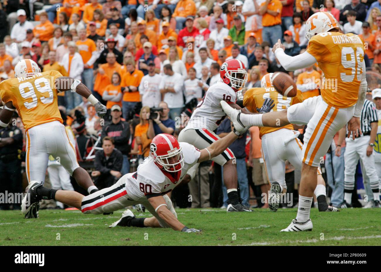 Georgia's Zach Renner (80) blocks a punt by Tennessee's Chad Cunningham ...