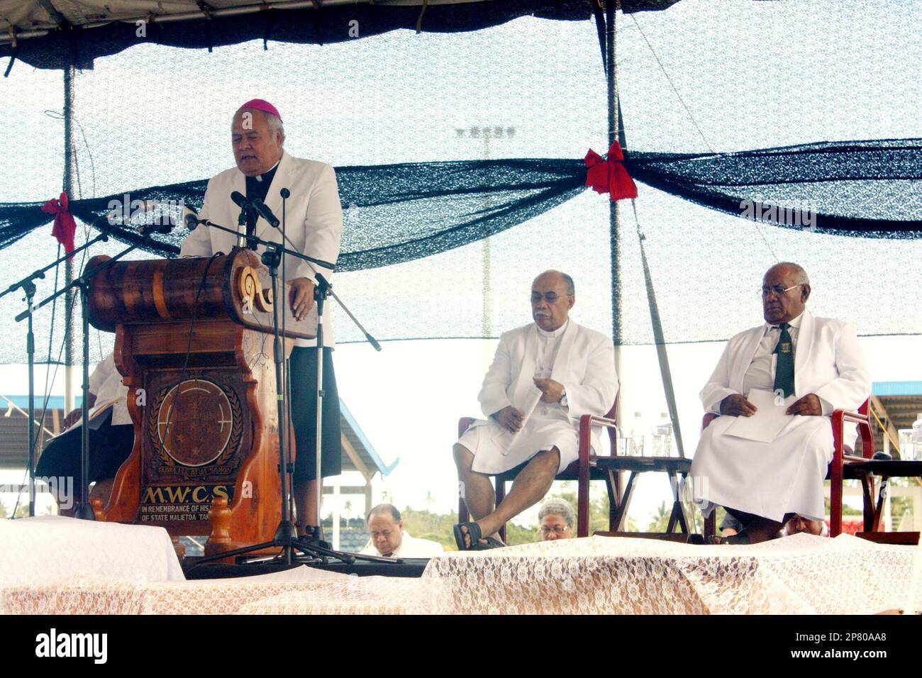 Archbishop Alapati Lui Mataeliga, left, offers prayers of intercession ...