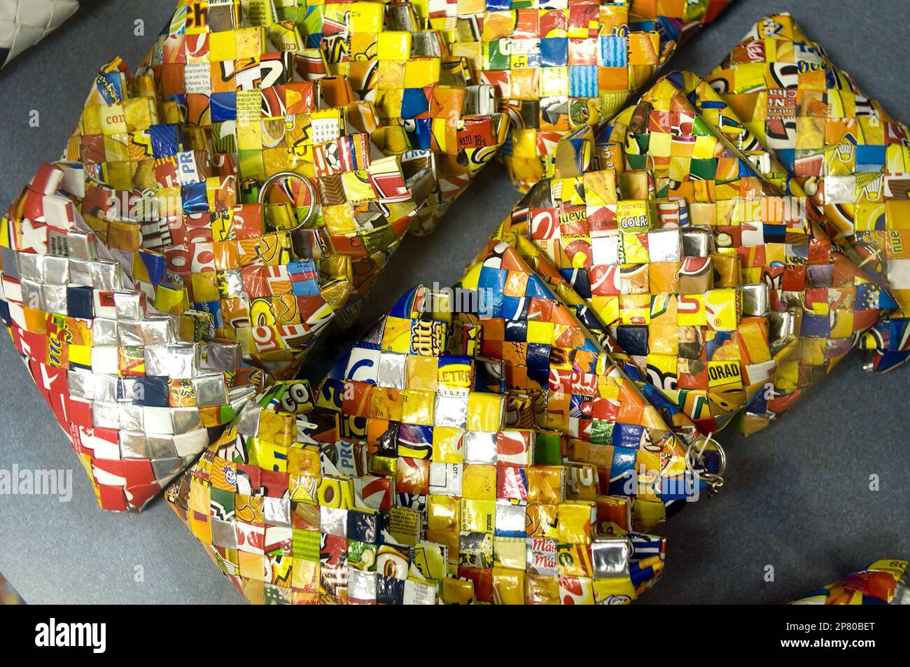 Handmade bags, constructed by Honduran women from snack chip bags, are ...